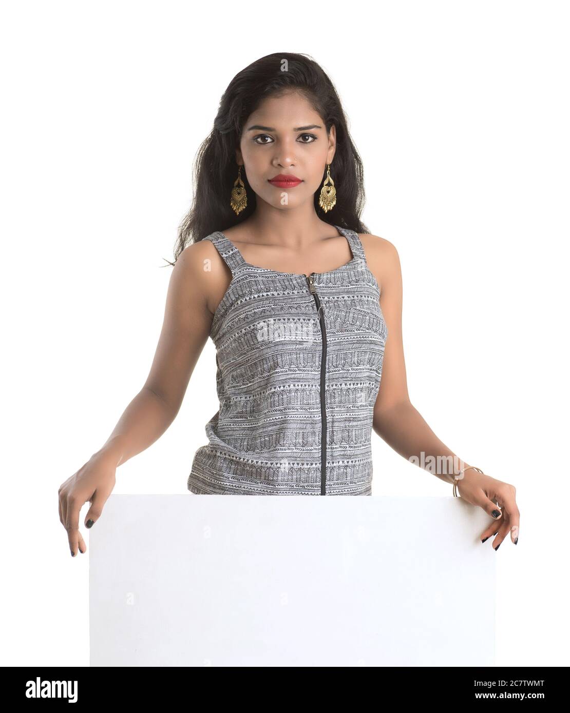 Beautiful young Girl holding white big signboard and posing Stock Photo ...