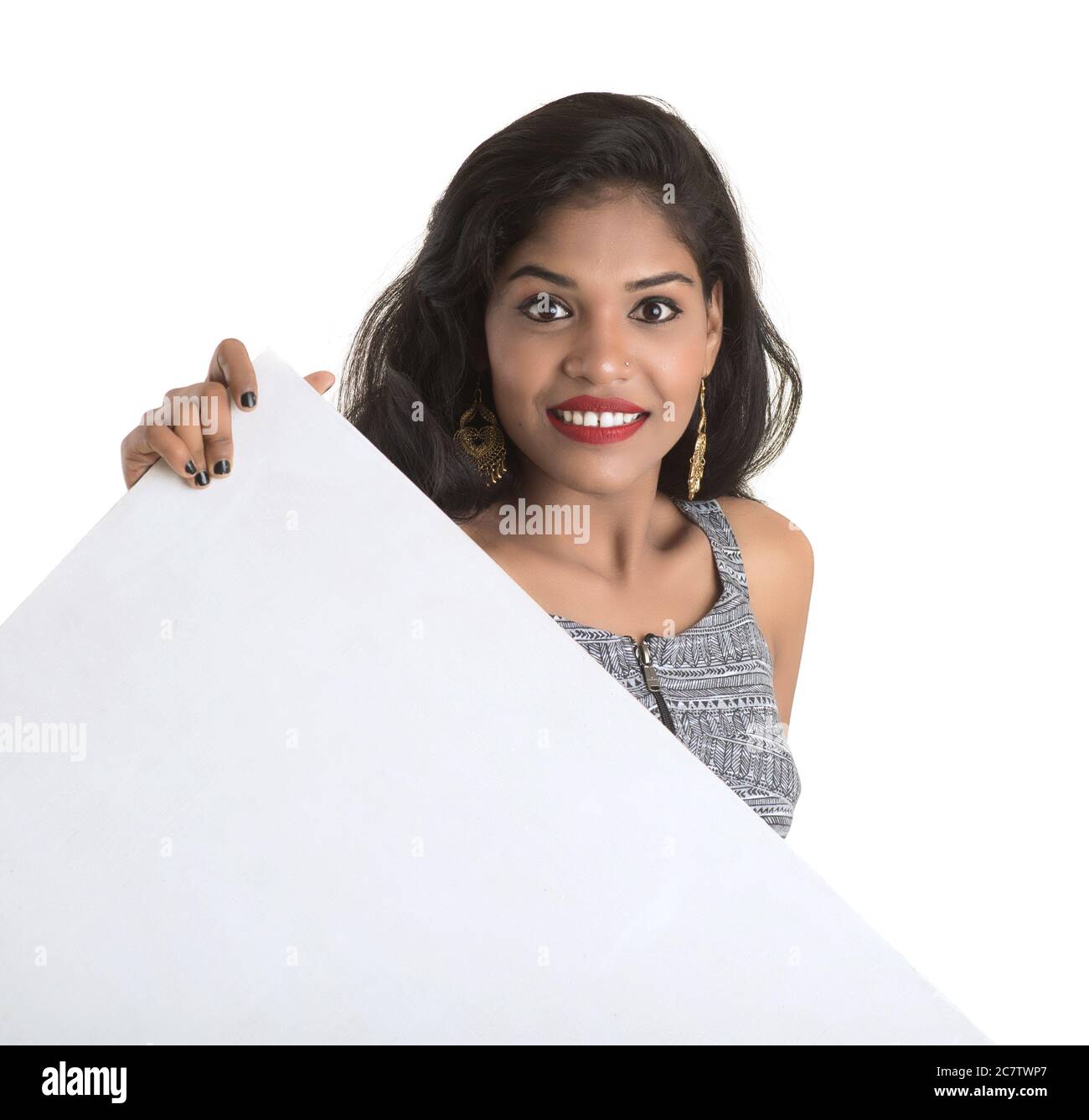Beautiful young Girl holding white big signboard and posing Stock Photo ...