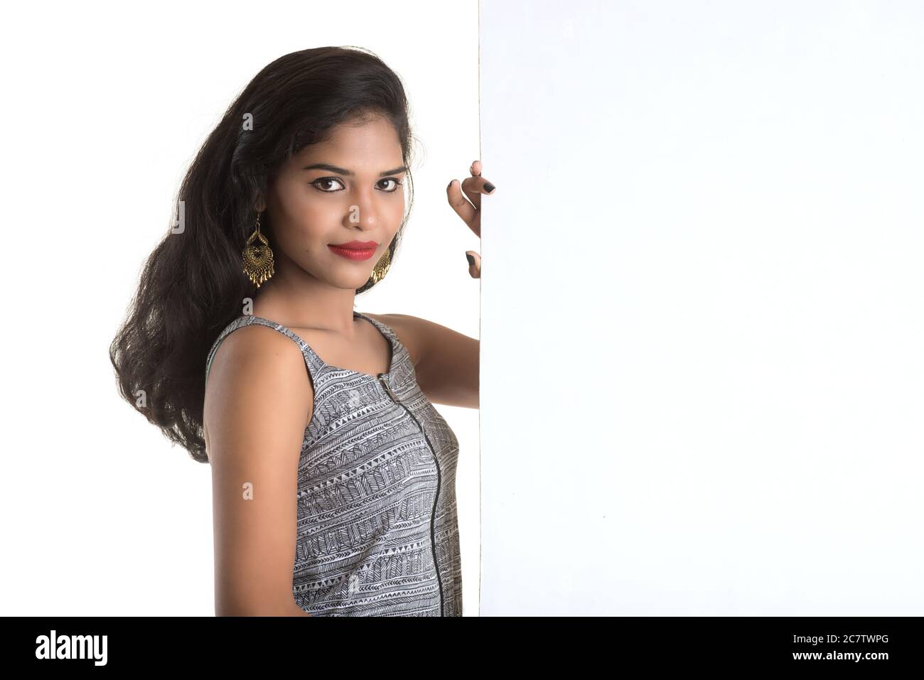 Beautiful young Girl holding white big signboard and posing Stock Photo ...