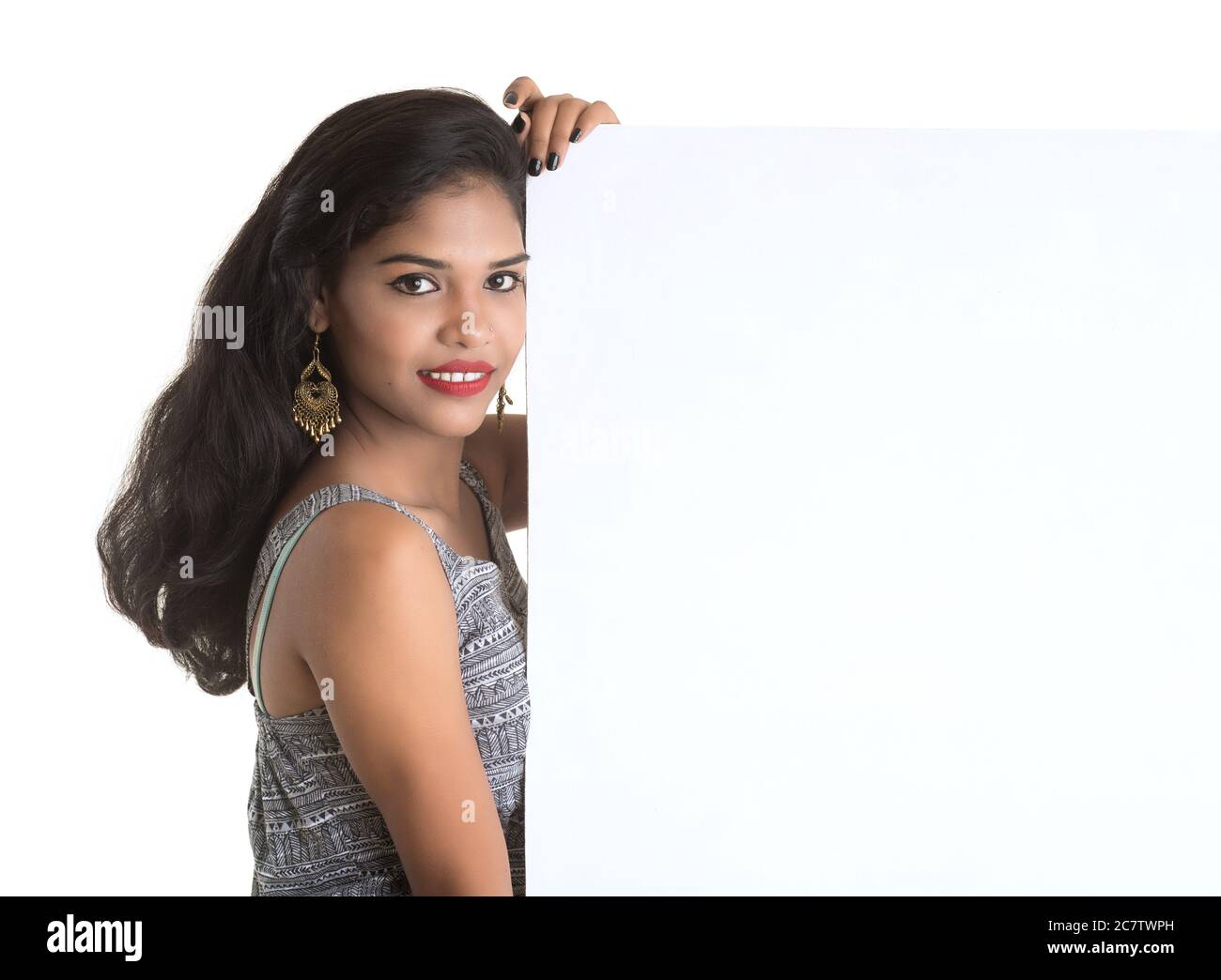Beautiful young Girl holding white big signboard and posing Stock Photo ...