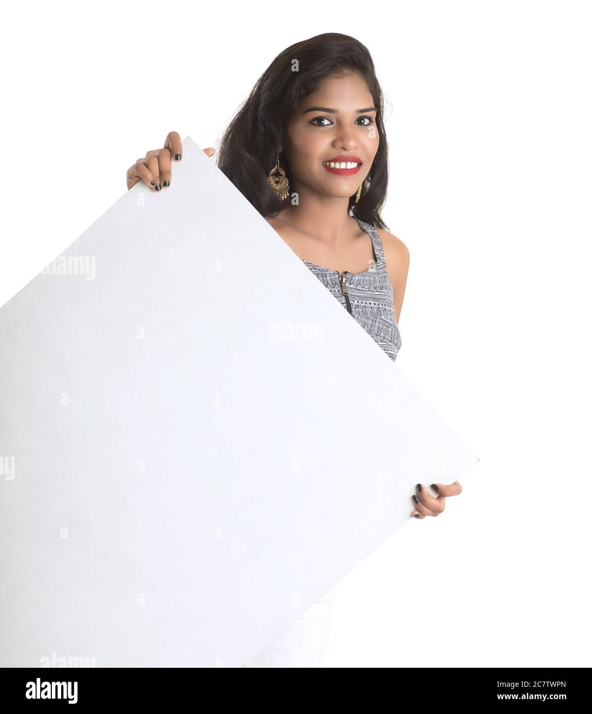 Beautiful young Girl holding white big signboard and posing Stock Photo ...
