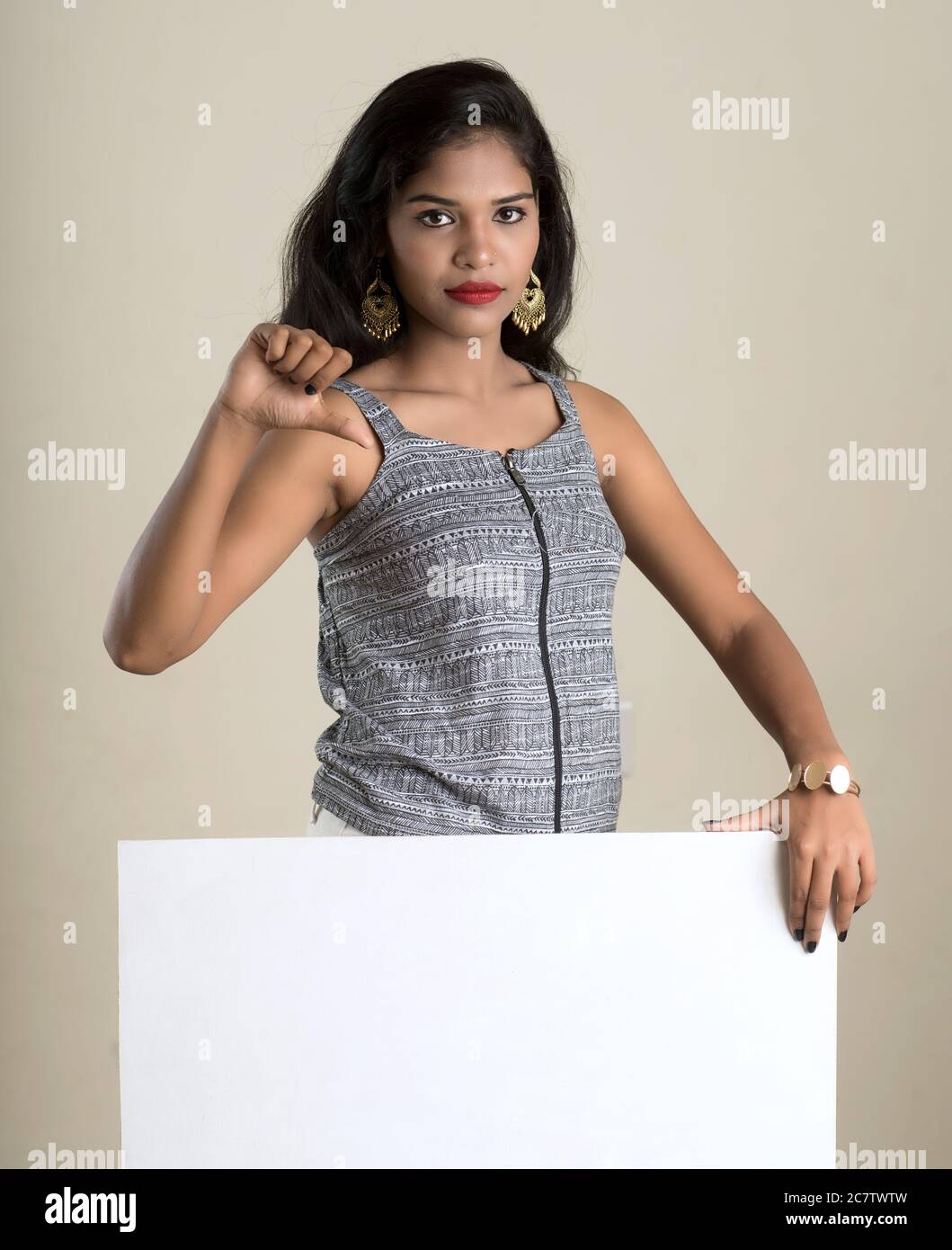 Beautiful young Girl holding white big signboard and posing Stock Photo ...
