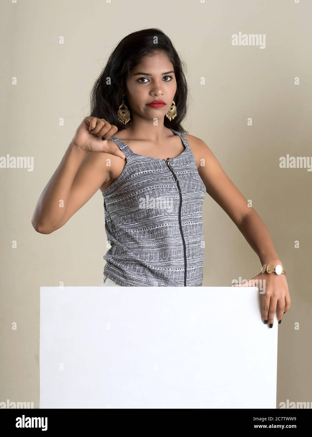Beautiful young Girl holding white big signboard and posing Stock Photo ...