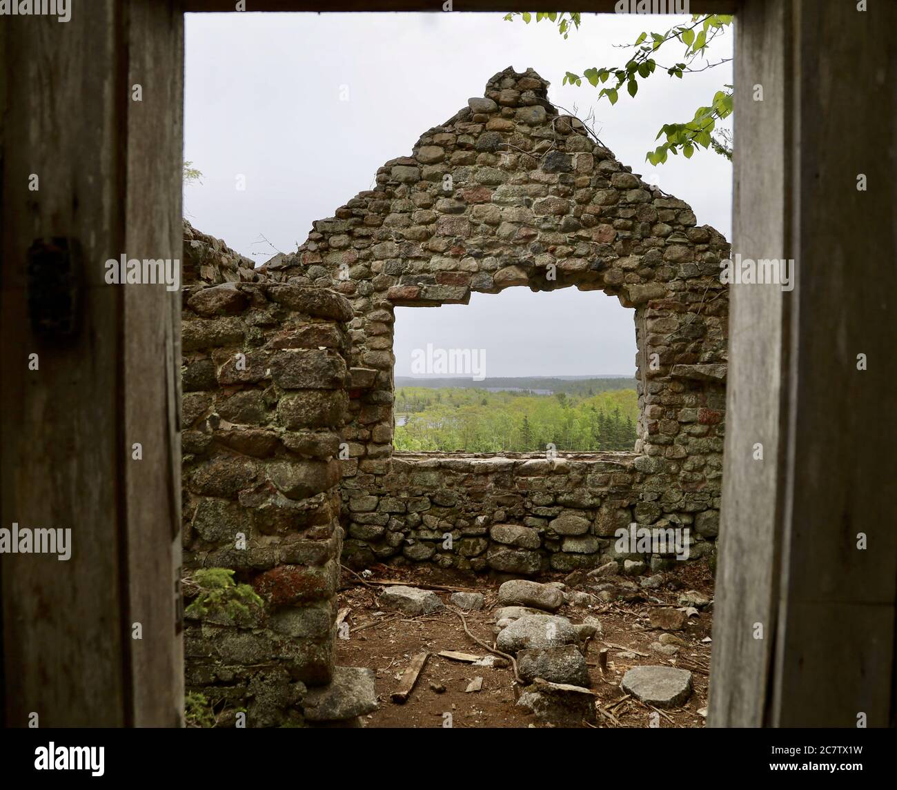 100-year-old stone ruins of a forgotten lodge surrounded by greenery ...