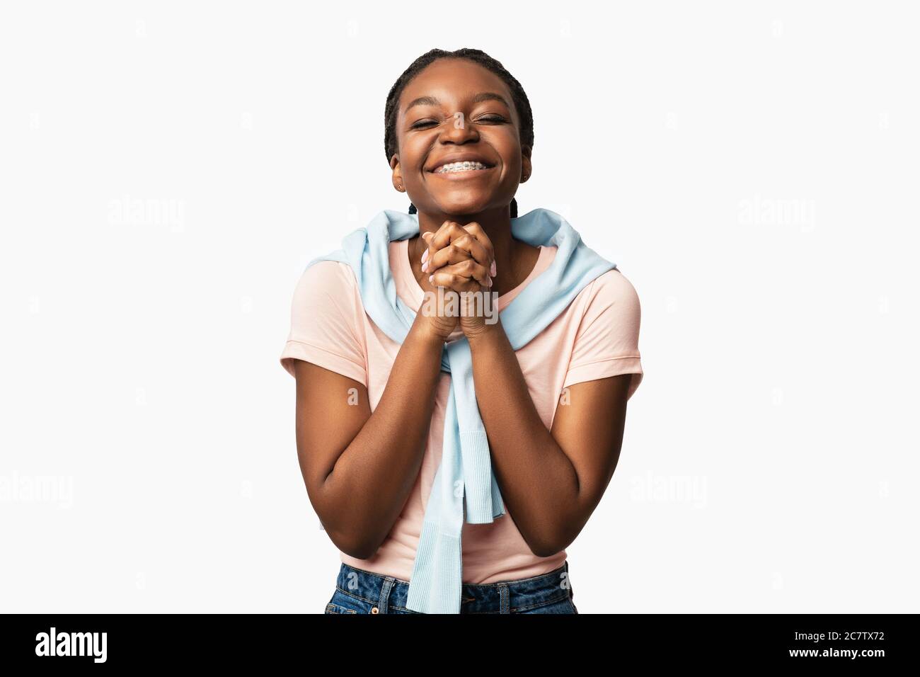 African American Girl Making Pleading Gesture On White Studio ...