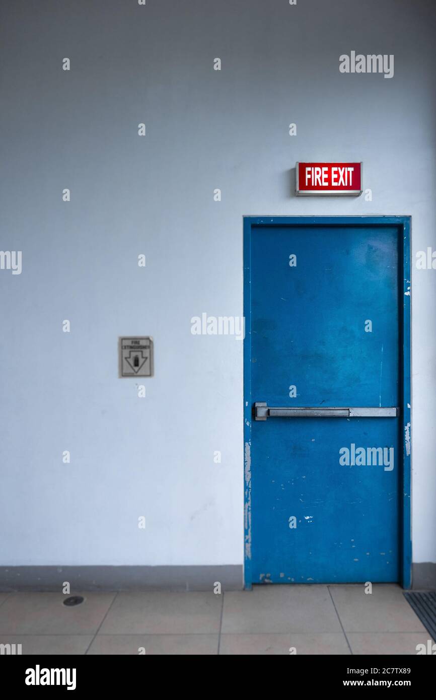Bright Fire Exit and Blue Door Stock Photo - Alamy