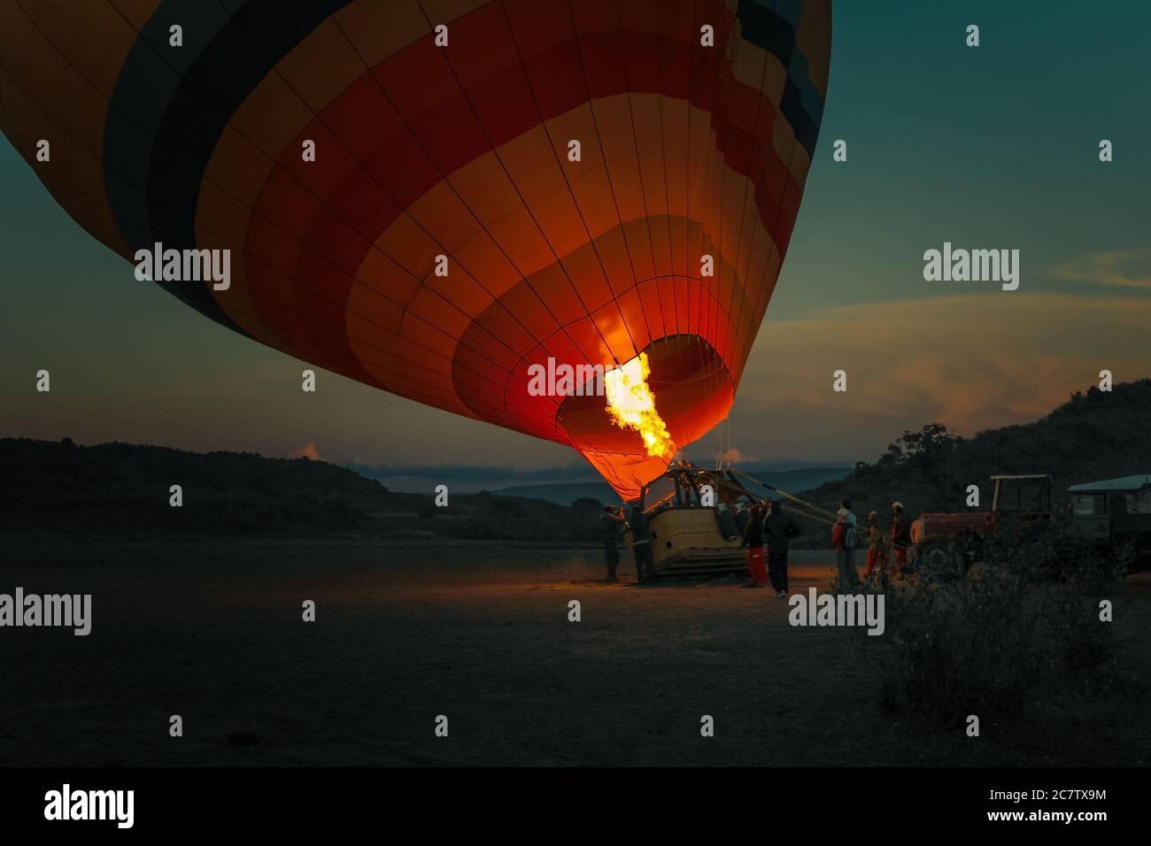 Hot air balloon with bright burning flame in the night Stock Photo - Alamy