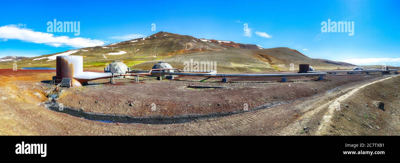 Icelandic landscape with geothermal power plant station and pipes ...