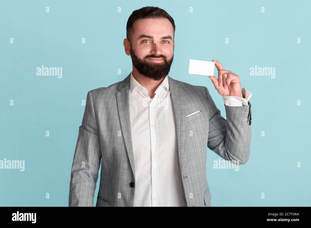 Happy CEO showing business card with empty space for design over blue ...