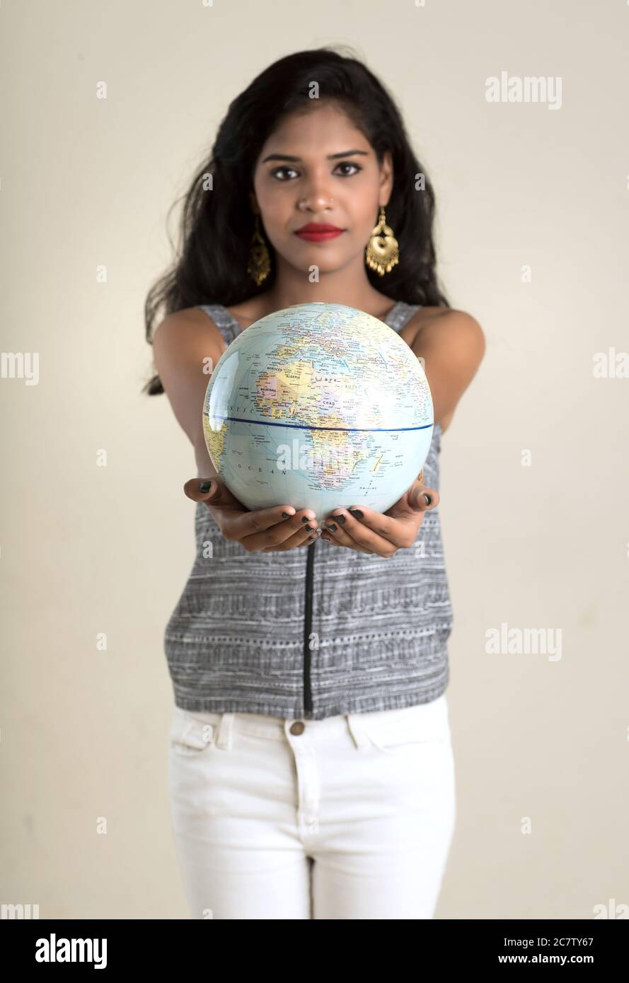 Portrait of young Girl holding and posing with a world globe Stock ...