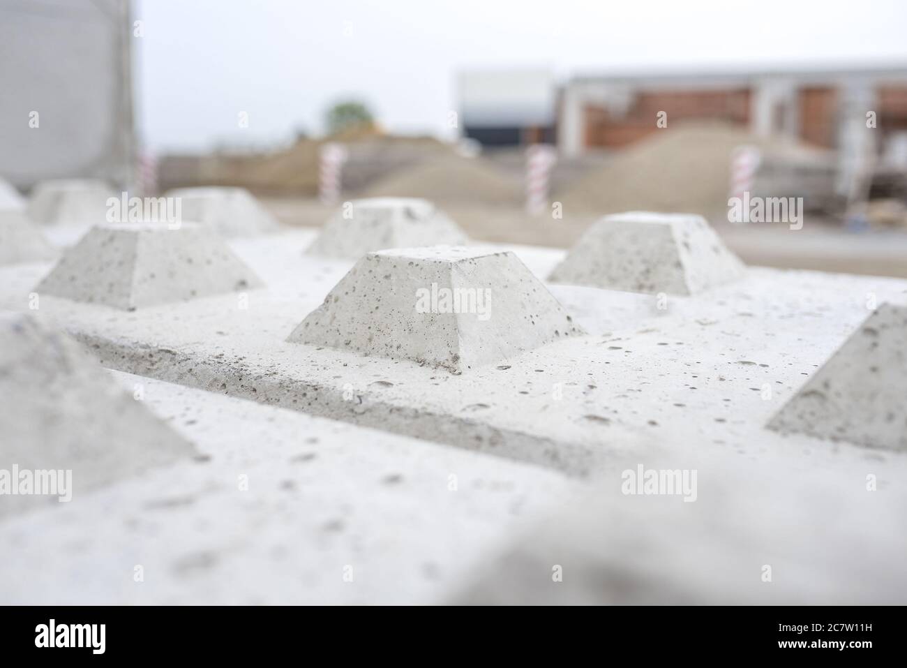 Selective focus of interlocking concrete blocks under the sunlight with ...
