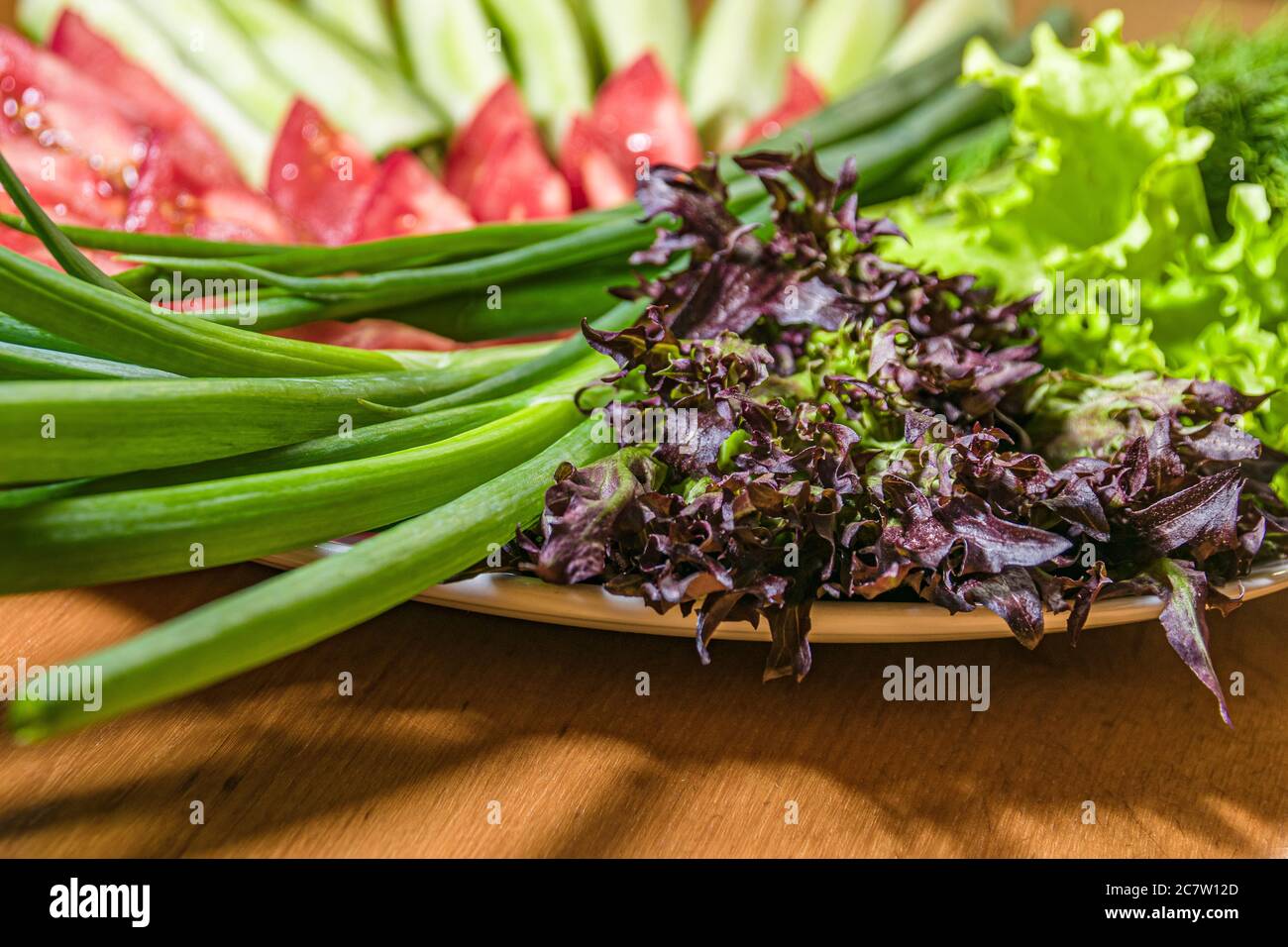 Delicious fresh raw vegetables. Chopped vegetables on a plate. Cooked ...