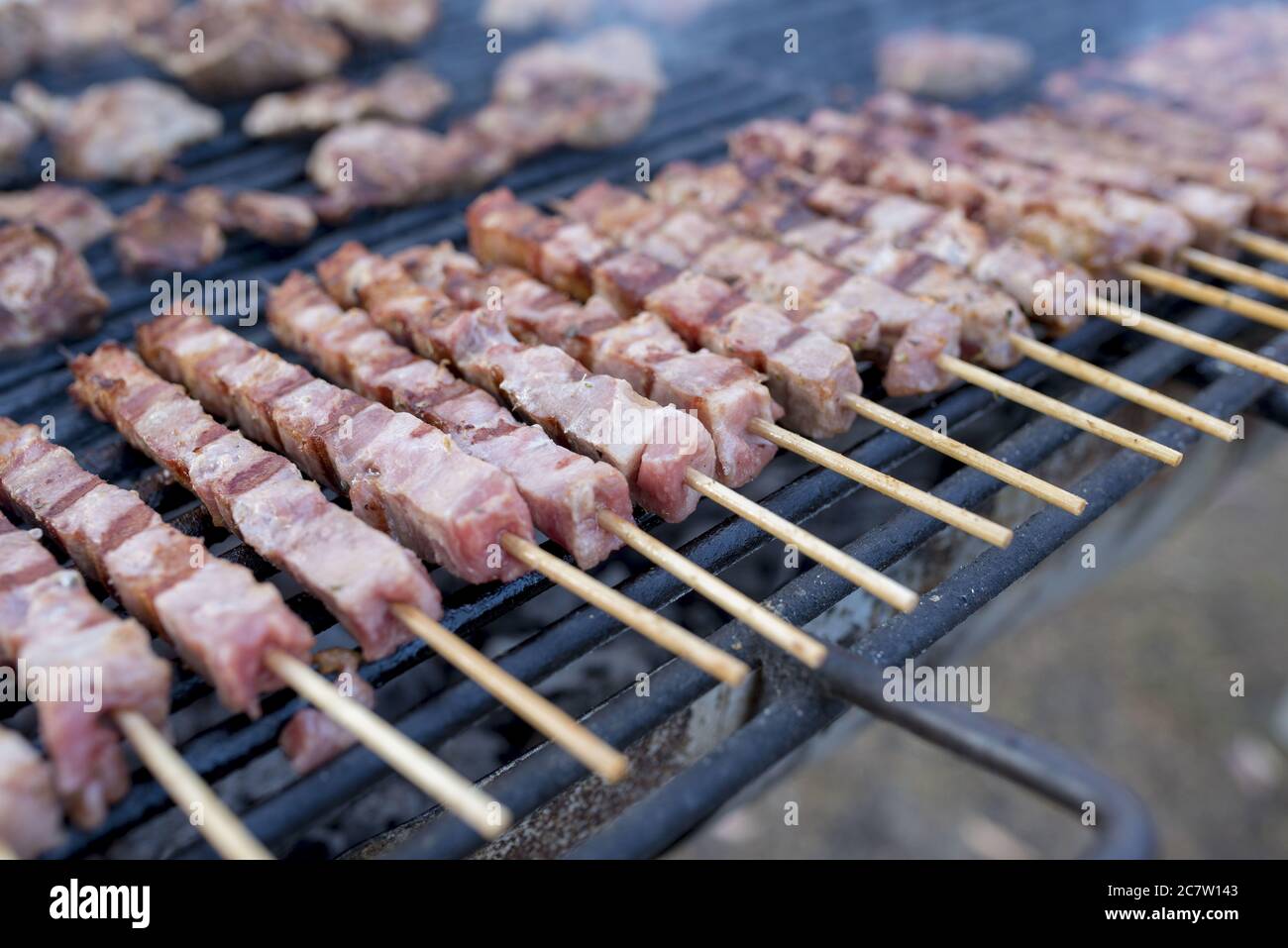 Closeup of barbecues on sticks on a grill under the sunlight Stock ...