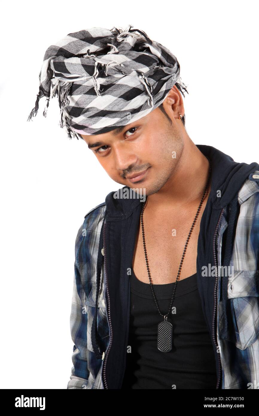 A handsome young Indian guy with a style, on white studio background ...
