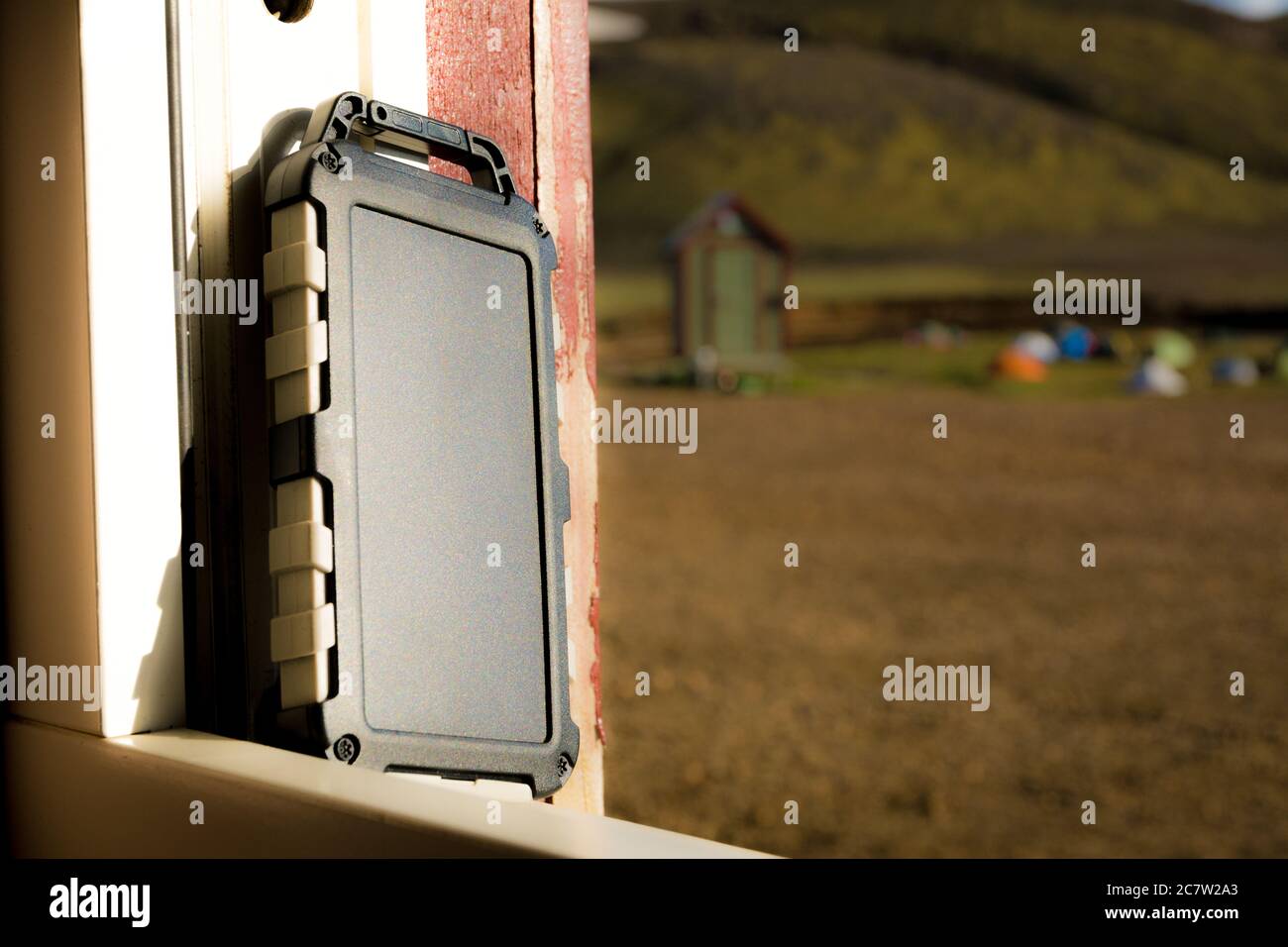 Rugged power bank battery with solar cell charging in the sun Stock ...