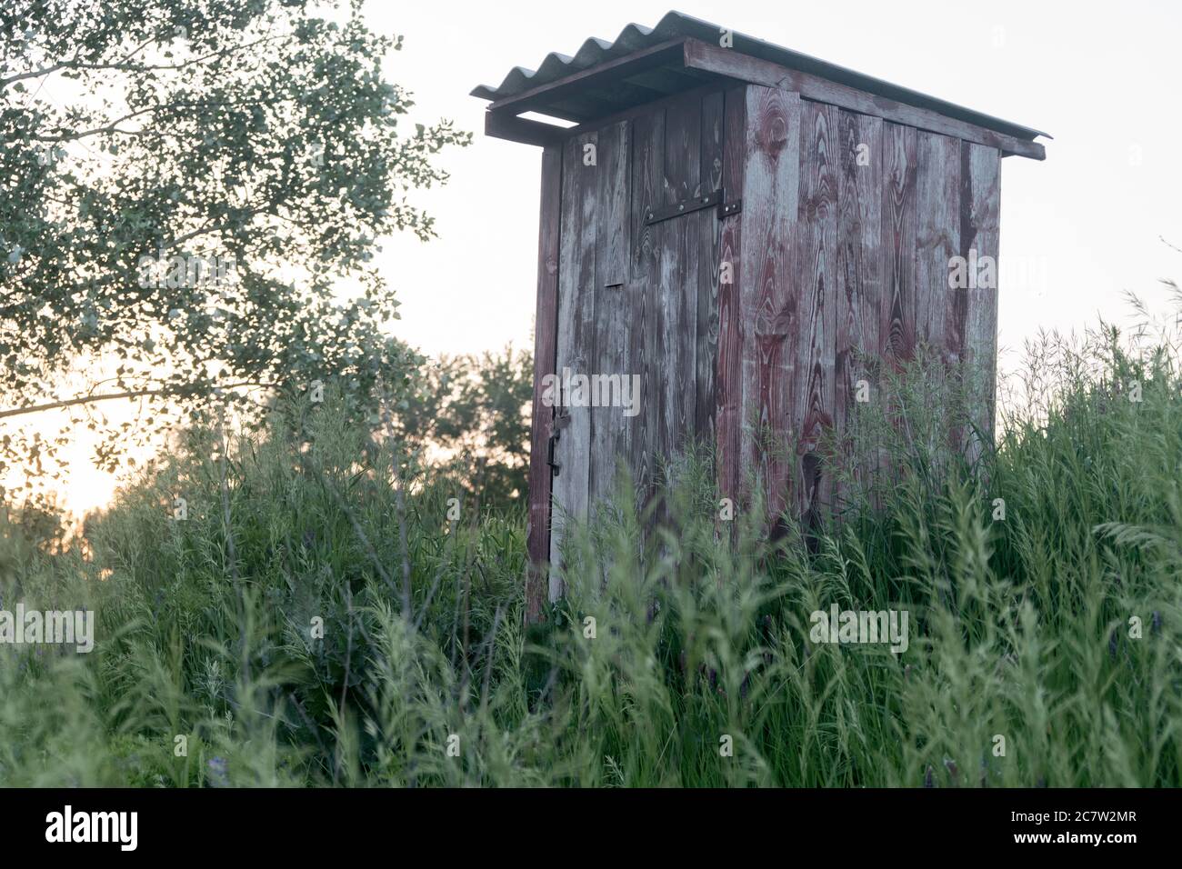 Old wooden double outhouse in the remote Russian village Stock Photo ...