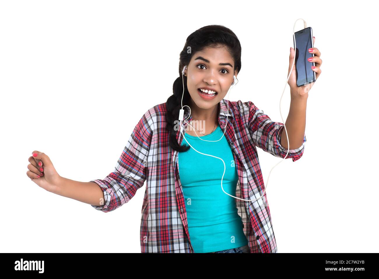 Young Indian girl using a mobile phone or smartphone isolated on a ...