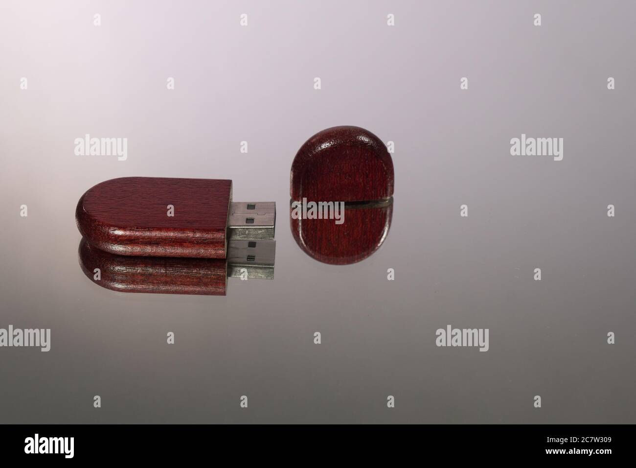 usb-sticks with open cap made with wooden, grey background Stock Photo ...