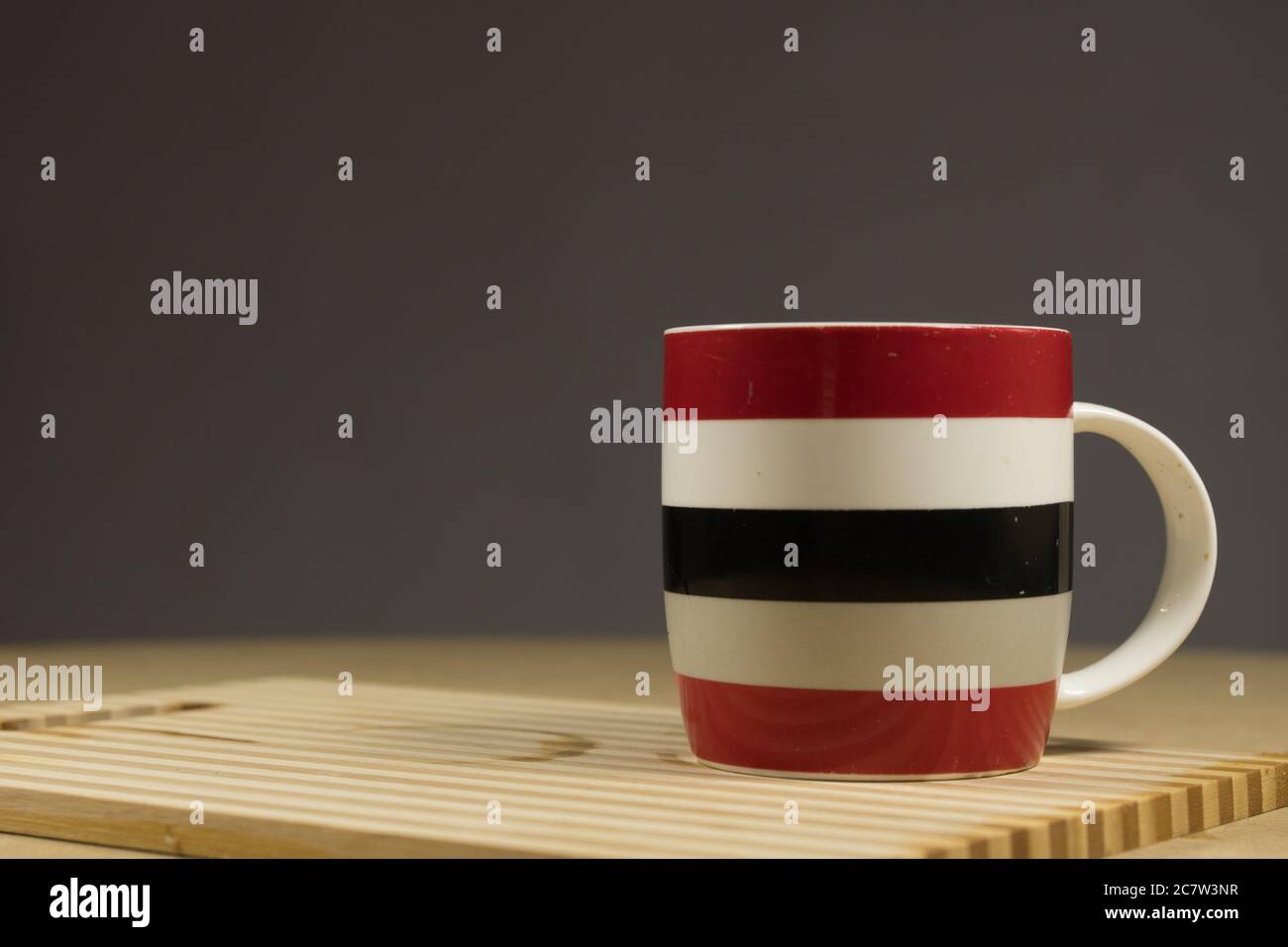 Red-white-blue mug on a blue background. The concept of a friendly ...