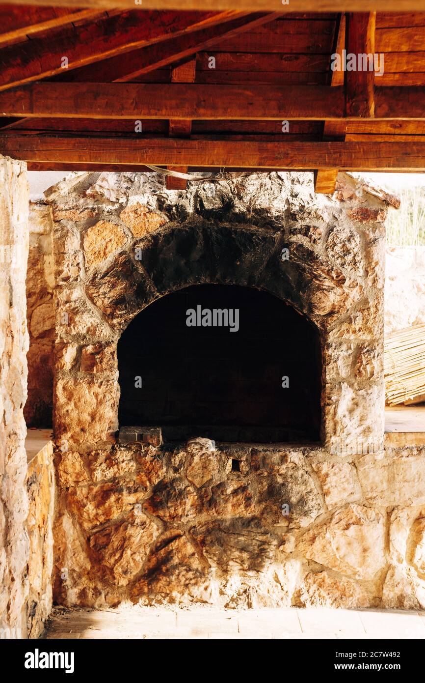 An ancient stone stove outside for cooking with black tan Stock Photo ...