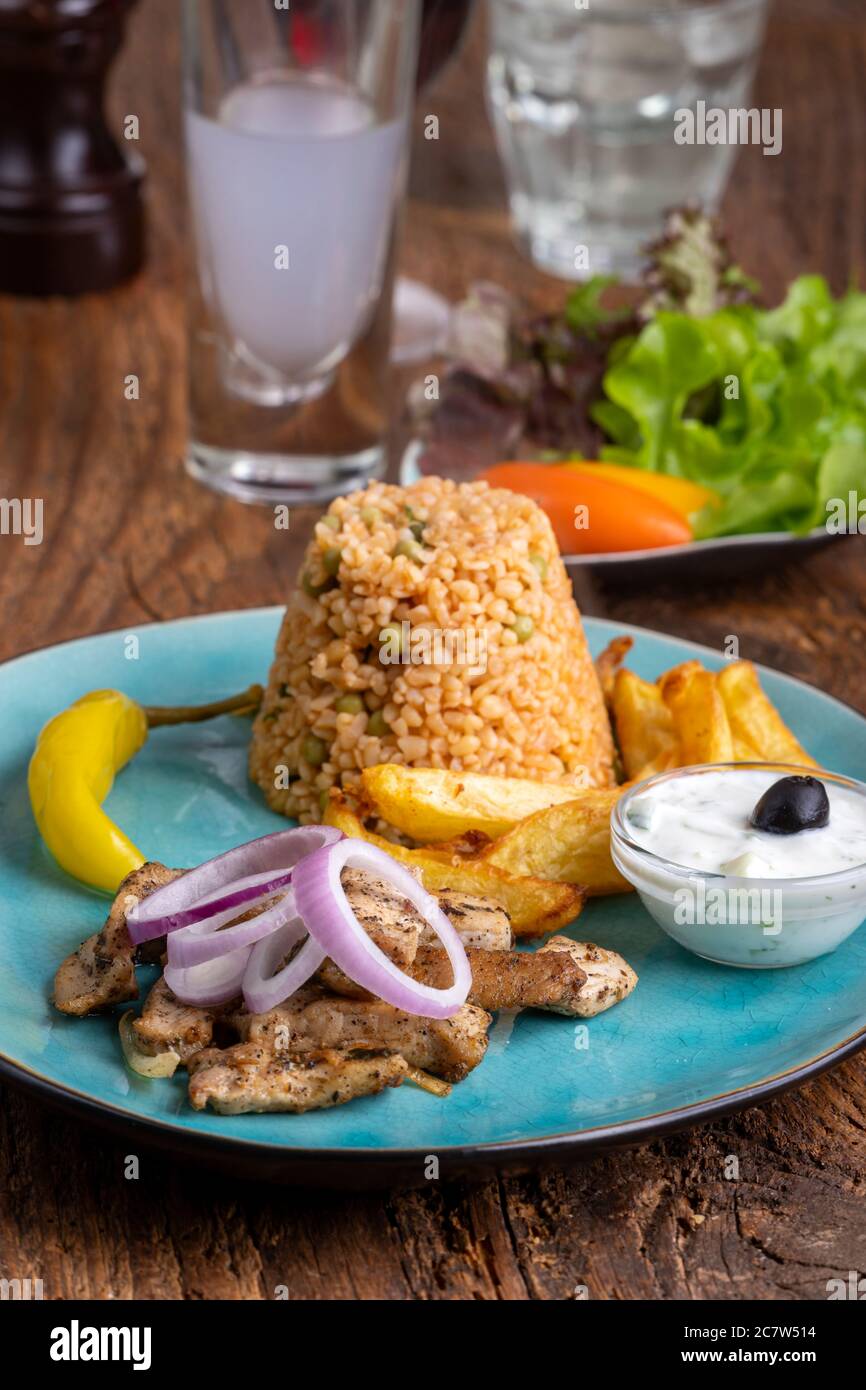 greek gyros with rice on wood Stock Photo - Alamy