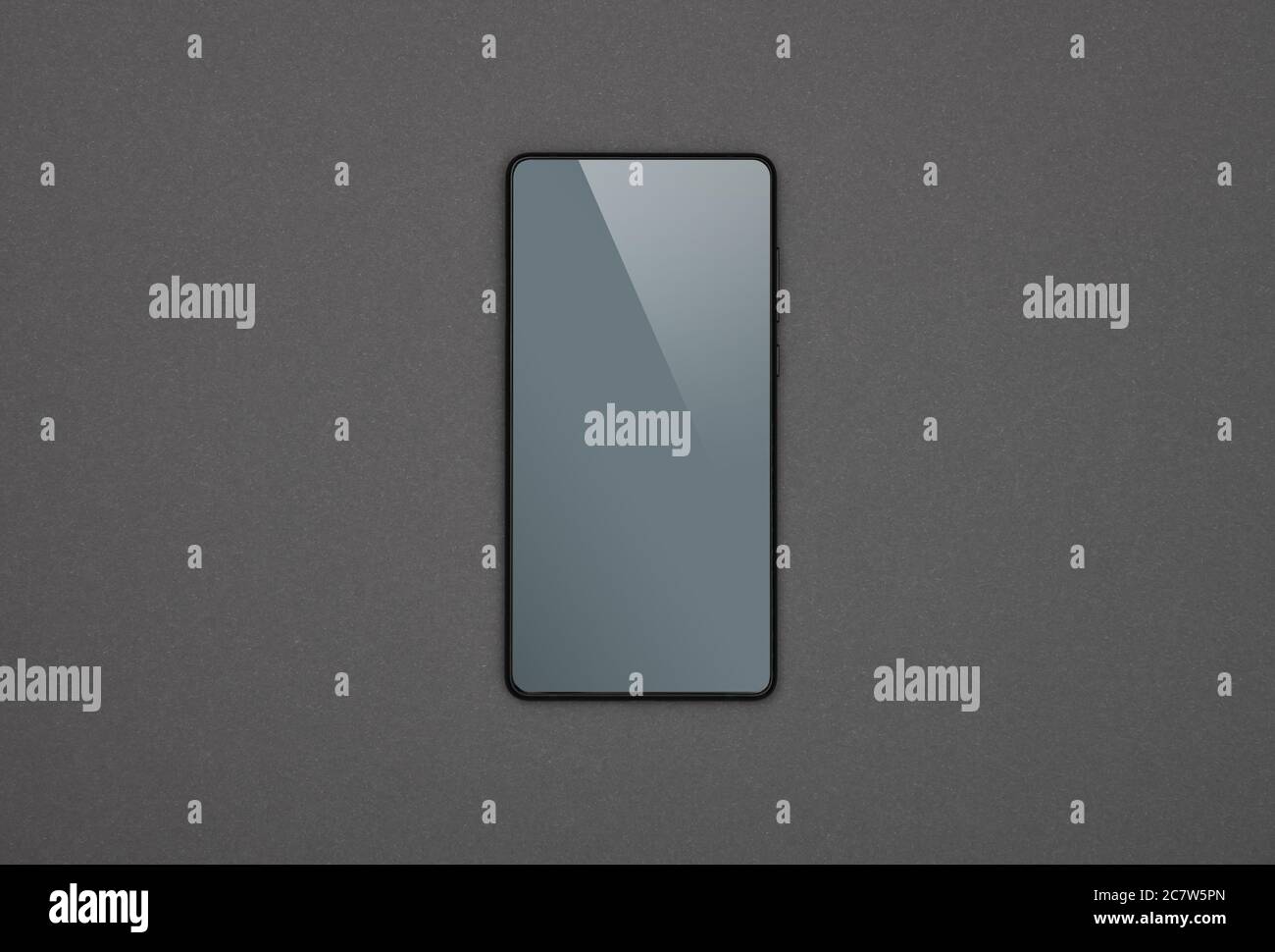 Close up one black smartphone with blank screen over grey paper ...