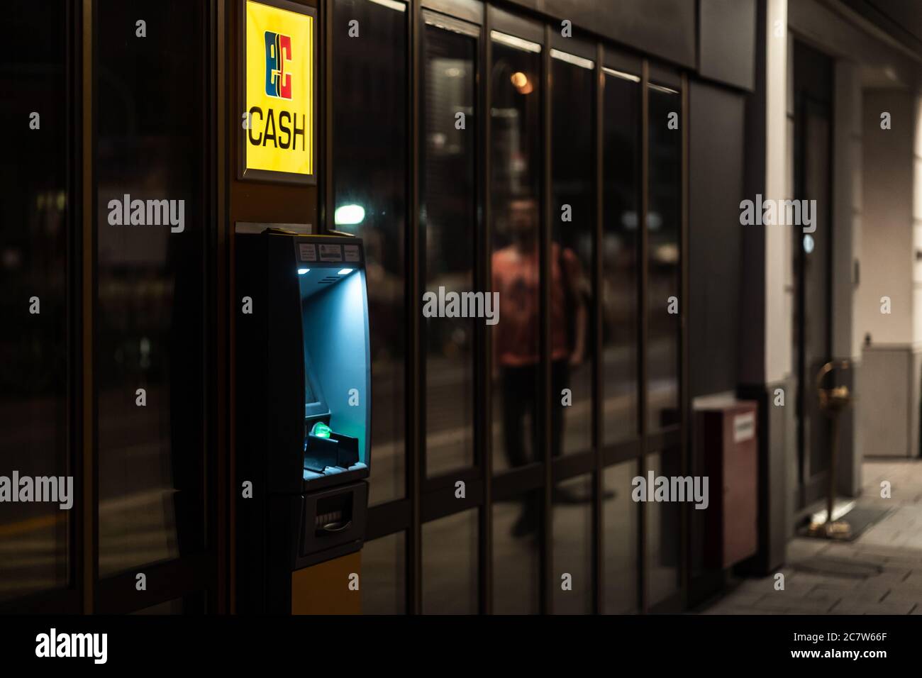 MUNICH, GERMANY - Jun 30, 2020: Illuminated ATM during the dark evening ...