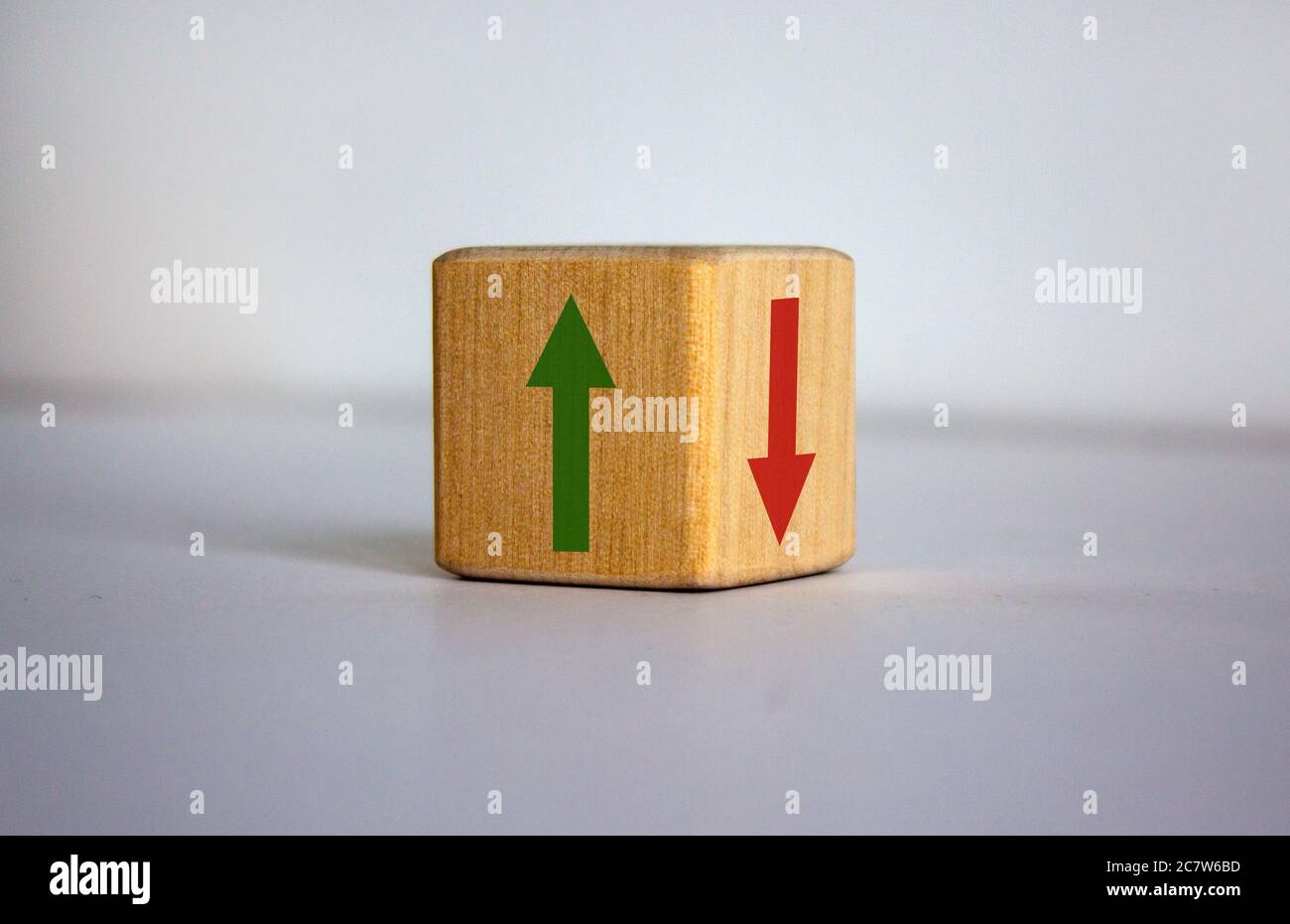 Conceptual image of choice and direction. Wooden cube with arrows ...
