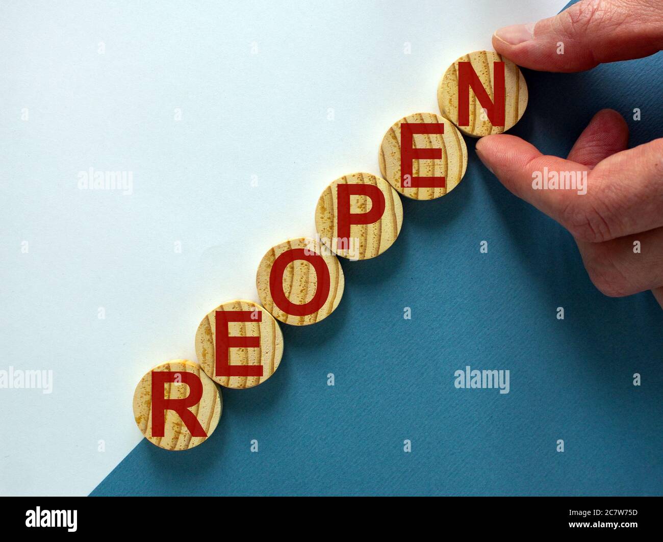 Wood circles with word 'reopen' stacking as step stair on paper blue ...