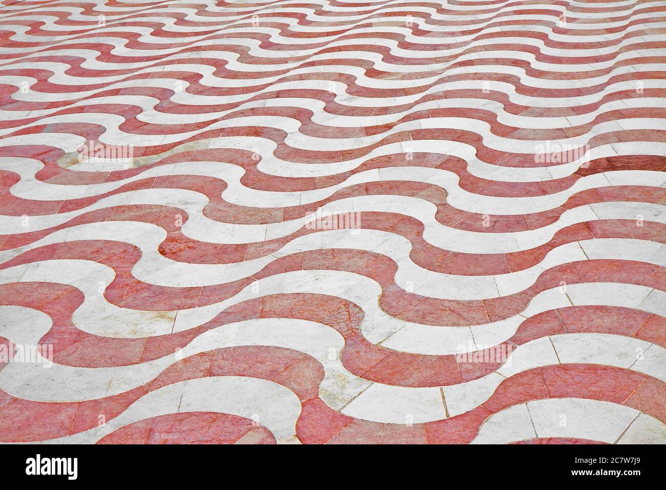 New modern paving made with stone wave-shaped in a italian pedestrian ...