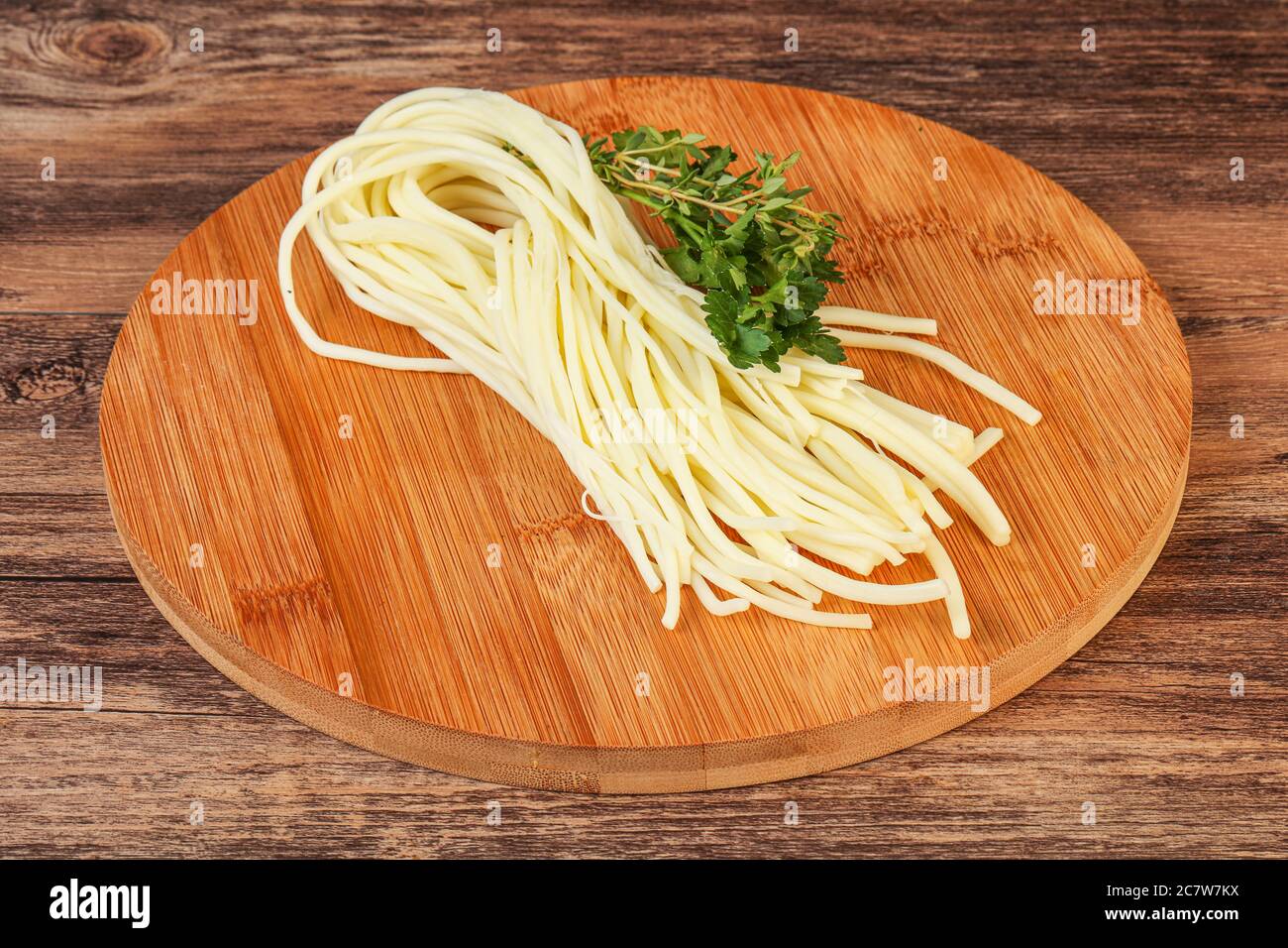 Chechil spaghetti cheese snack over board Stock Photo - Alamy