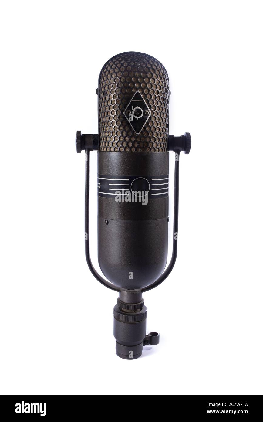 A vertical shot of a microphone behind a white surface Stock Photo - Alamy