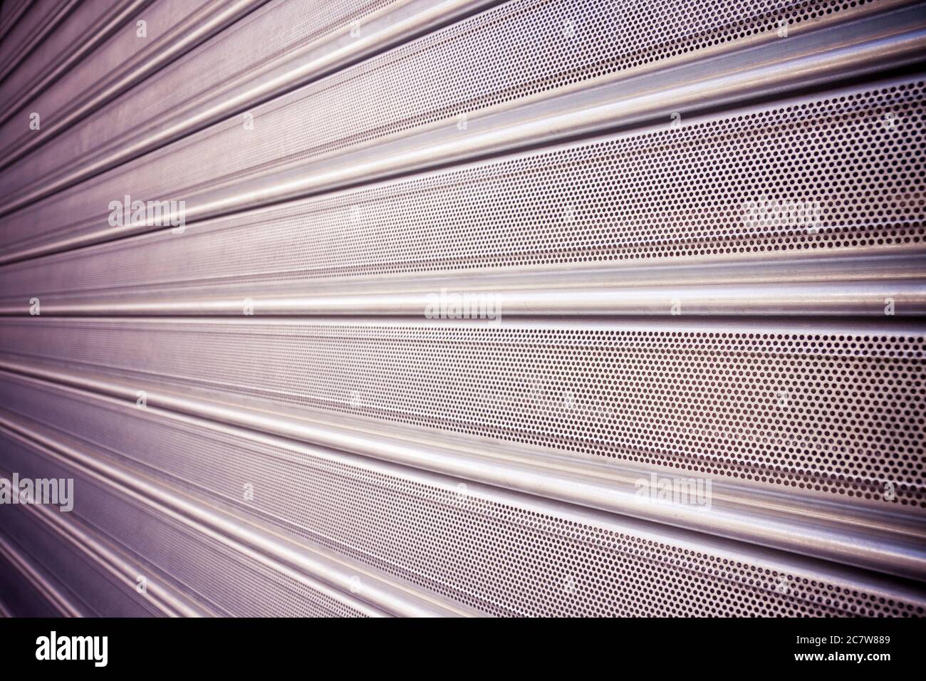 New closed metallic shutter door with perforated sheet Stock Photo - Alamy