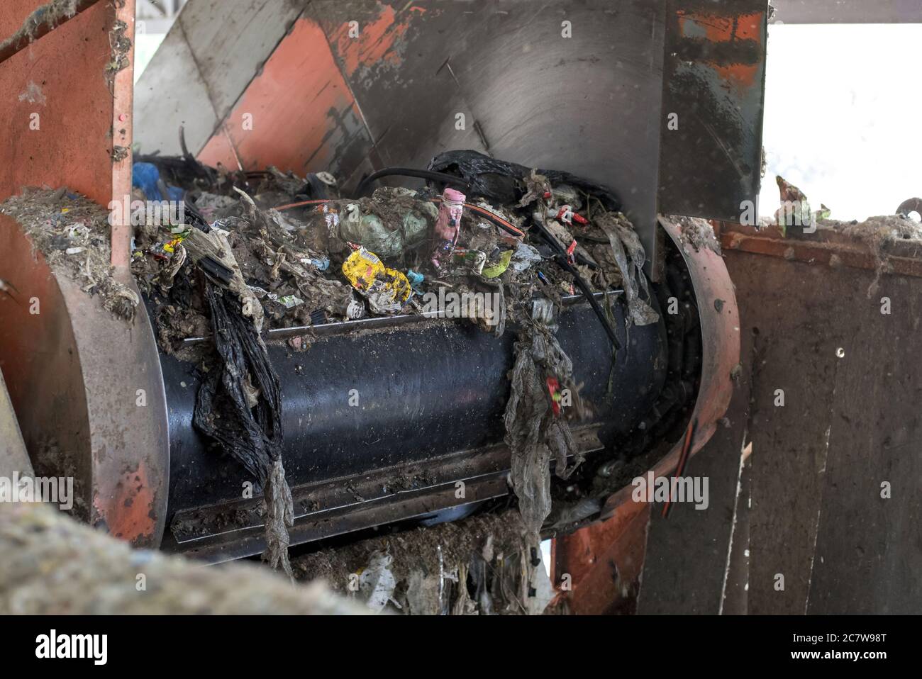 Closeup shot of municipal solid waste transported by belt conveyor in ...
