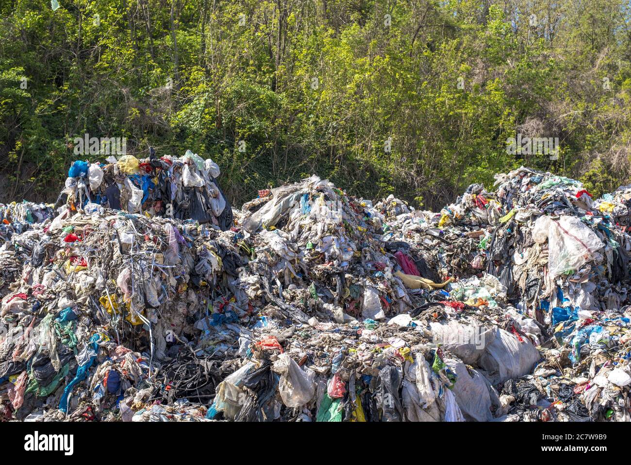 Pile of municipal waste on a disposal site ready for recycling Stock ...