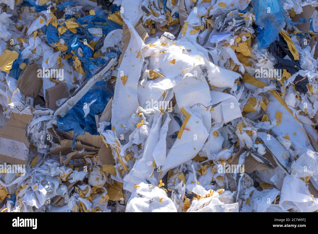 Pile of industrial waste including sponges and cardboard on a disposal ...