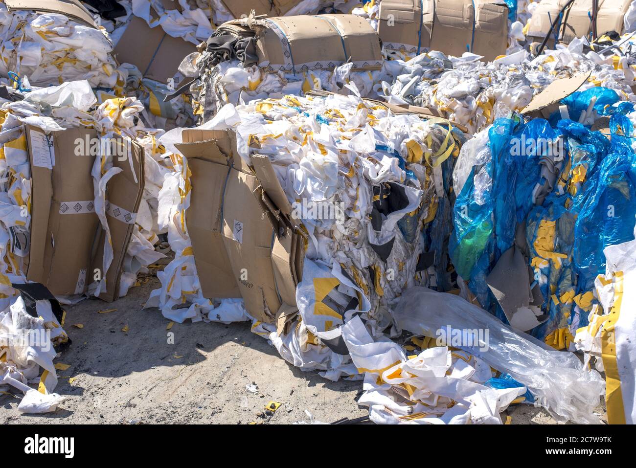 Pile of industrial waste including sponges and cardboard on a disposal ...