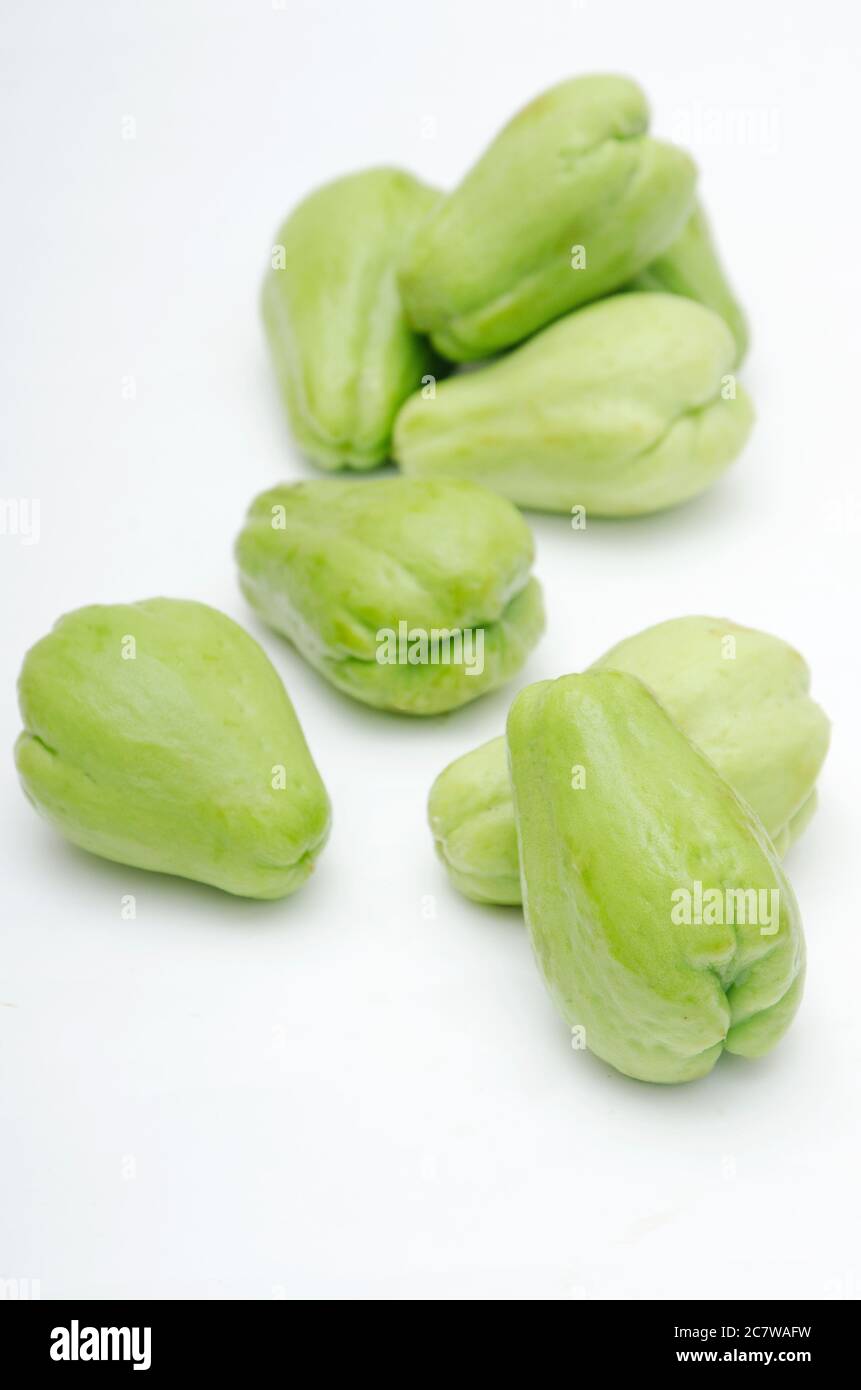 green and fresh chayote in white background Stock Photo - Alamy