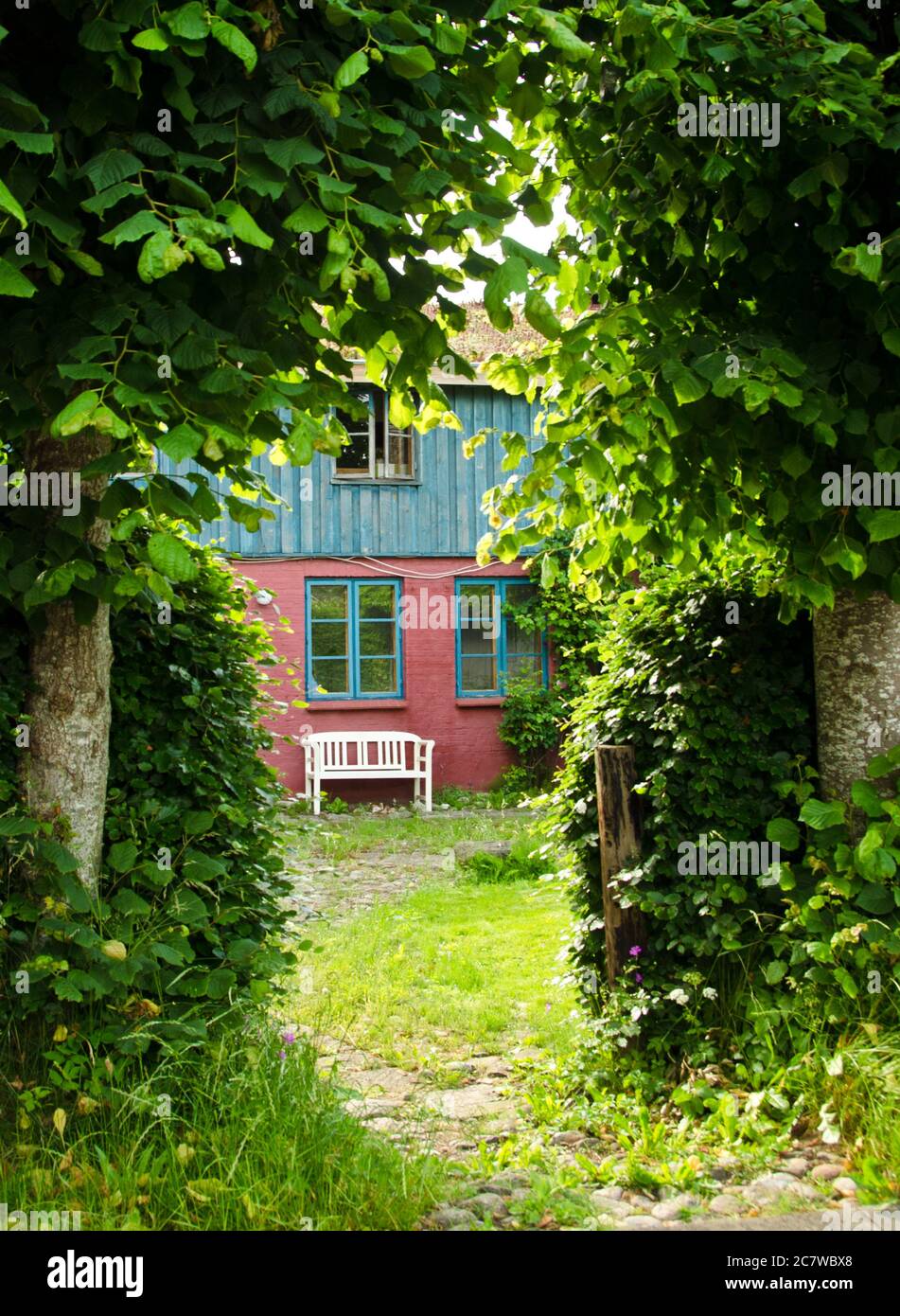 Beautiful and romantical entrance and garden of an old german farmhouse ...