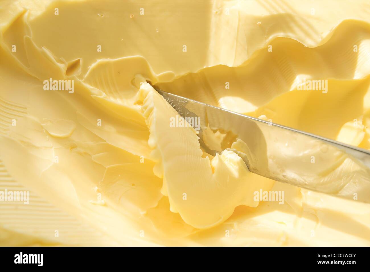 Closeup image of a butter knife and butter Stock Photo - Alamy