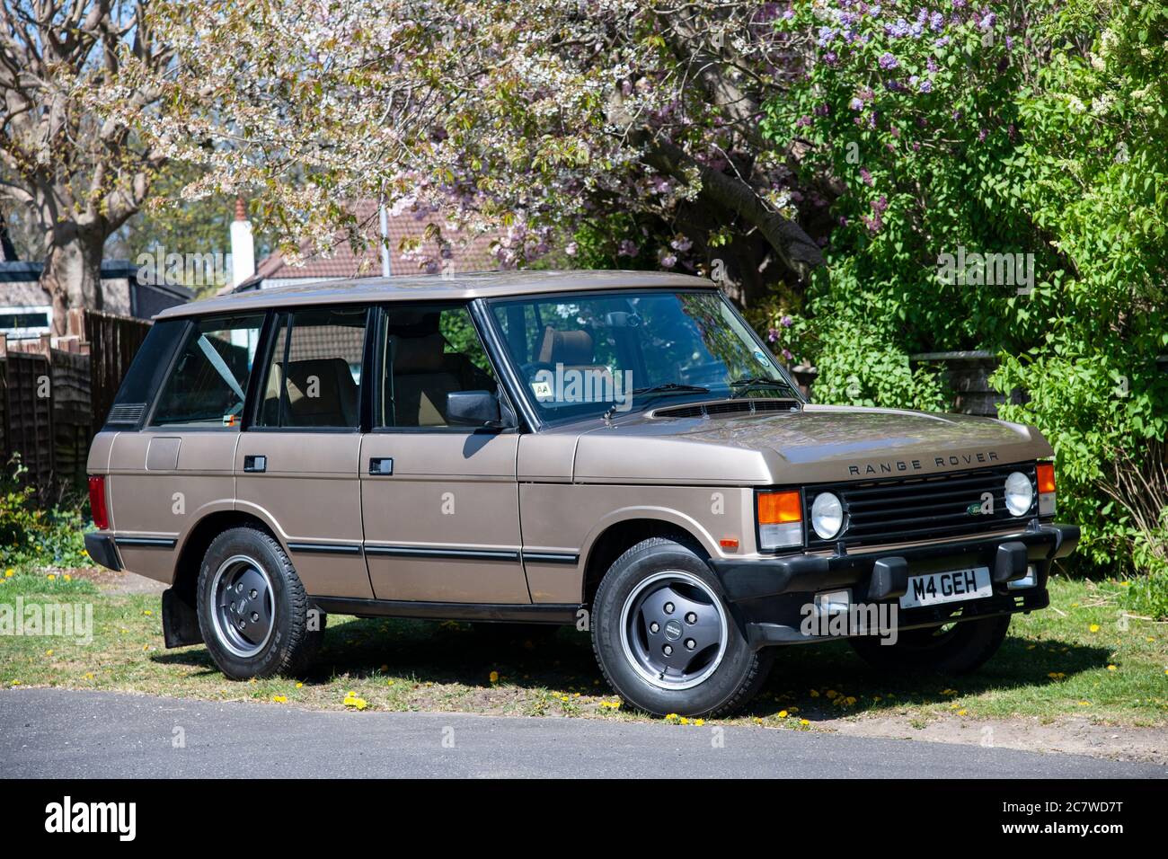 Gold Nineties Range Rover Vogue parked on a leafy suburban side street ...