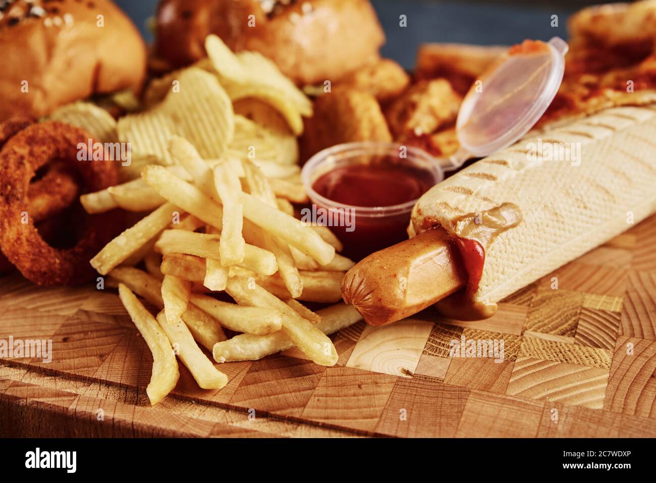 Unhealthy and junk food. Different types of fast food on the table ...