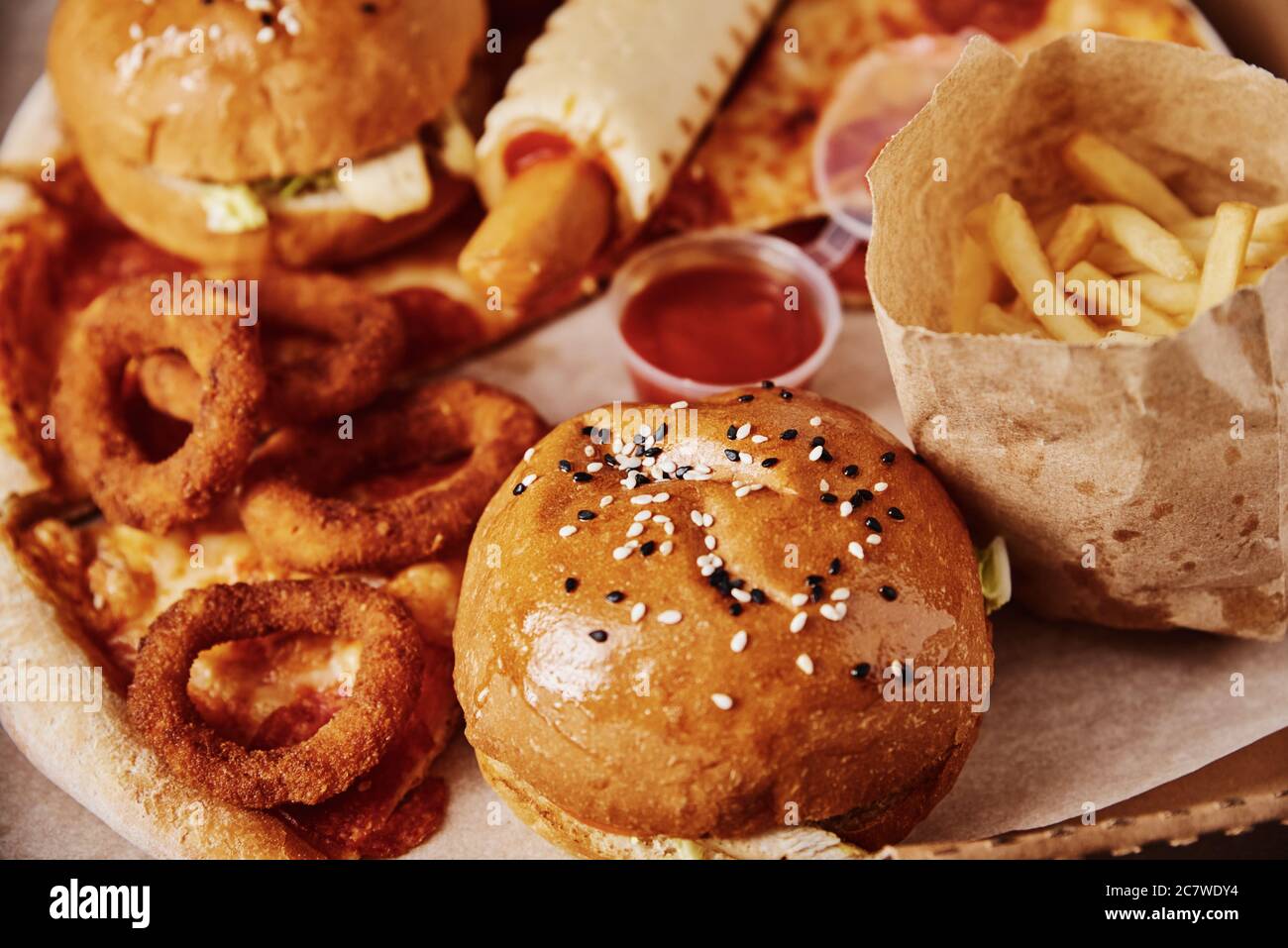 Unhealthy and junk food. Different types of fast food on the table ...