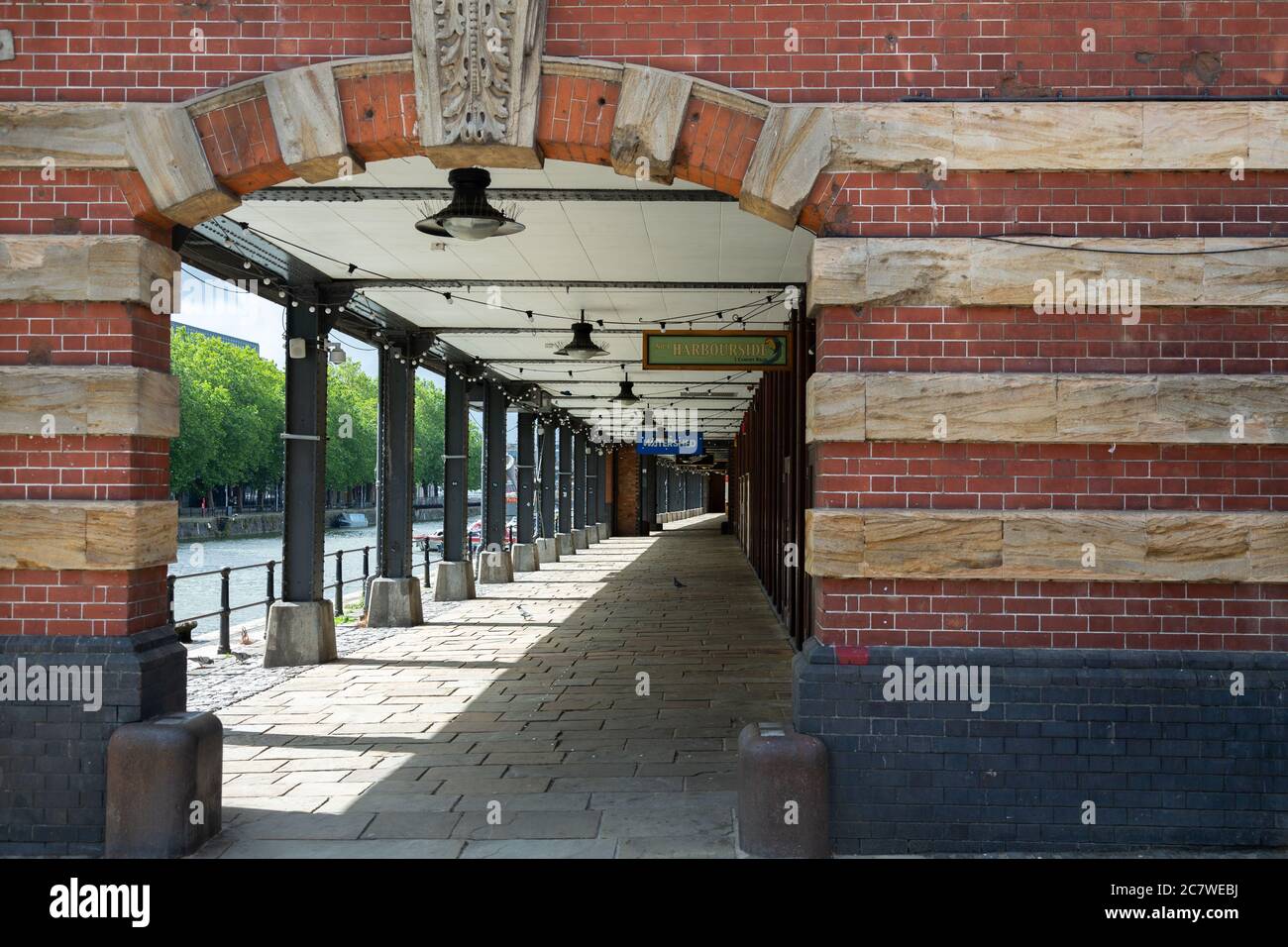 Red brick and sandstone archway on the waterfront buildings of the ...