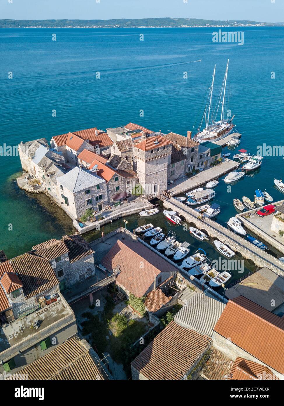 Split, Croatia - August 19 2019: Aerial view, old castle Kaštel Gomilica near Split, Croatia on ...
