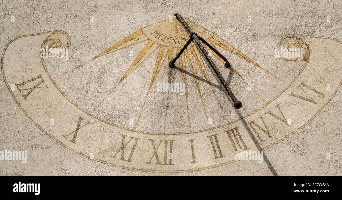 Old sun clock painted on a wall Stock Photo - Alamy