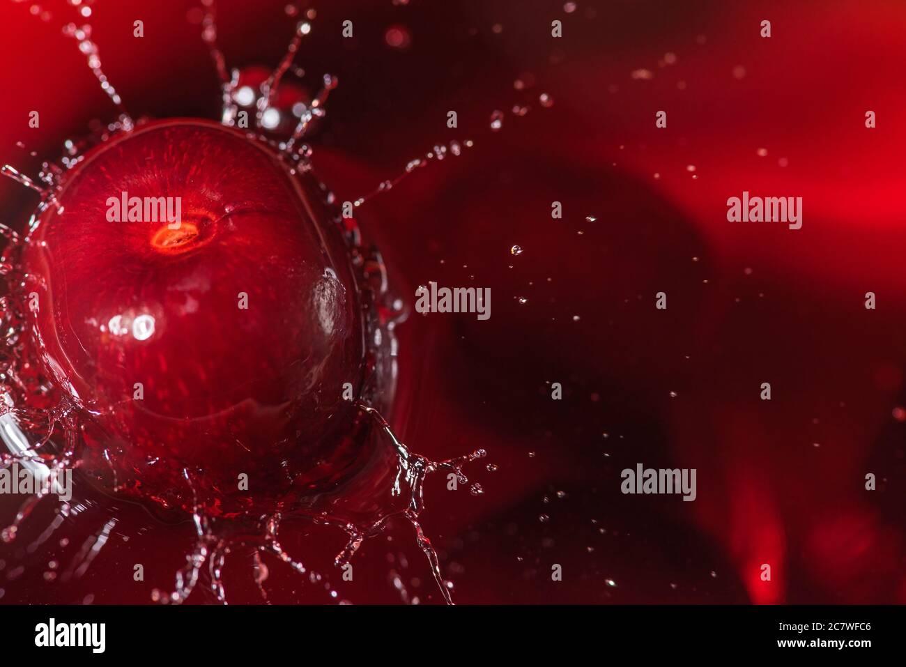 Cherry juice splash with fresh berry. close up shot Stock Photo - Alamy