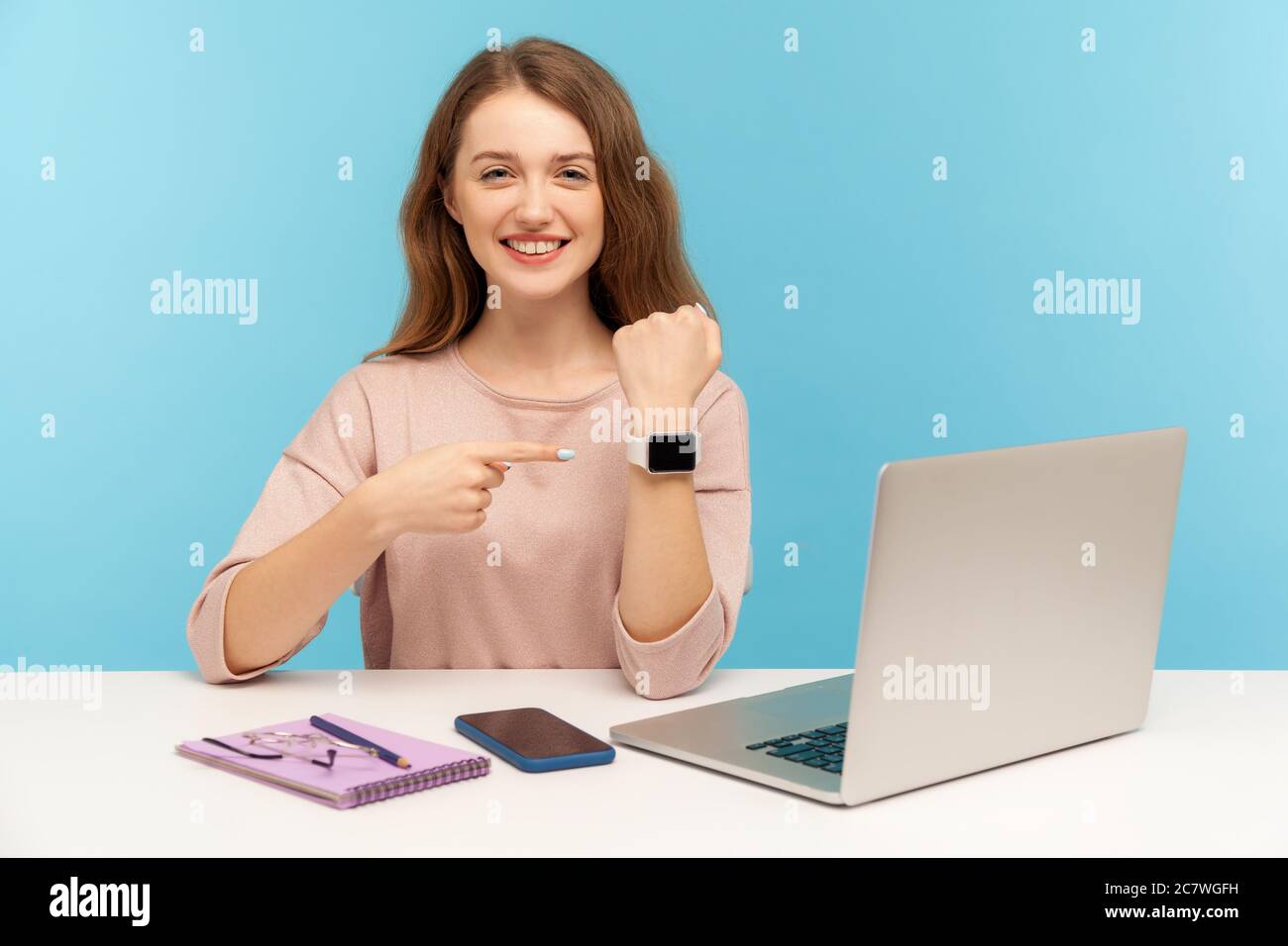 Look at clock, time to work! Positive businesswoman sitting workplace ...