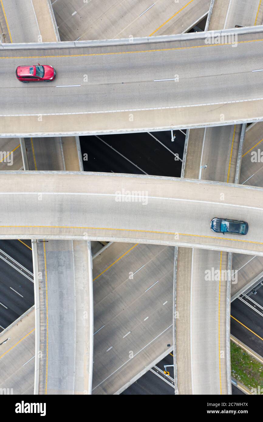Overhead shot of asphalt road on different levels and cars driving on ...