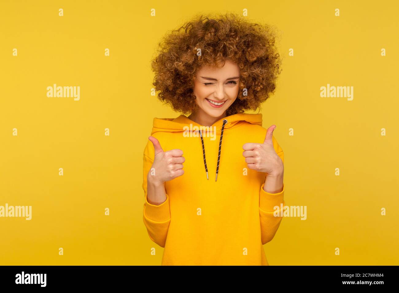 Woman winking thumbs up hi-res stock photography and images - Alamy